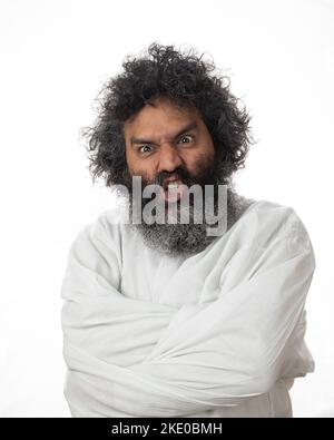 A crazy man expressing anger and discomfort in a straitjacket - the ...