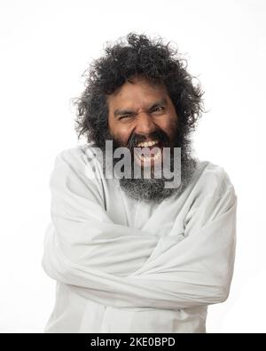 A crazy man expressing anger and discomfort in a straitjacket - the ...