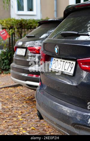 A vertical shot of a black BMW in the street Stock Photo - Alamy