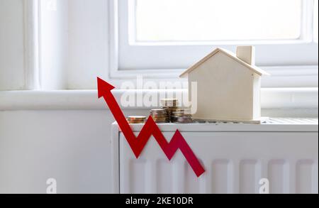 Home heating bills increase. Red up arrow with a house on a heating ...