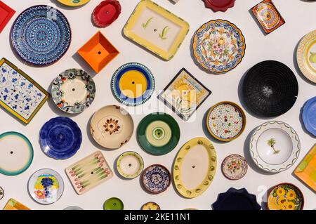 Collection of colorful Portuguese ceramic pottery, local craft products ...