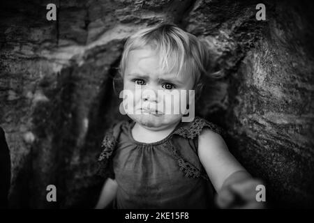 Portrait of little girl crying with tears rolling down her cheeks. Girl ...