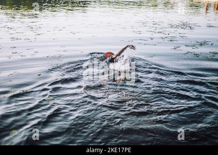 Mature man practicing freestyle swimming in lake Stock Photo - Alamy