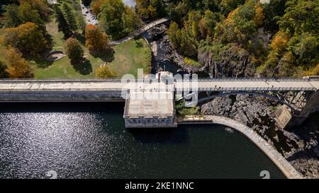 A drone shot of the New Croton Reservoir on a sunny day in autumn with ...