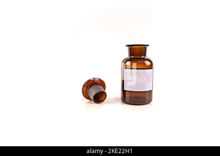 Brown medical jar with a glass stopper on a white background with a ...