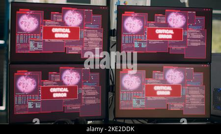 Computers displaying hacking attack alert and security breach in empty it development office ...