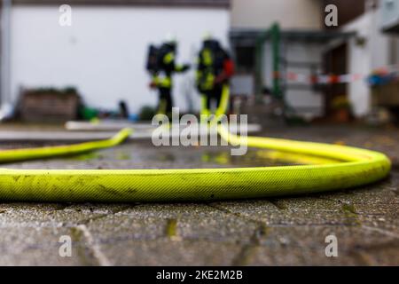 Staufen, Germany. 05th Nov, 2022. A firefighter dispenses water from a ...