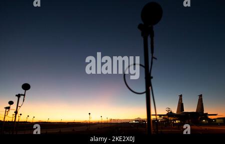 The sun rises on the microphone array used to record audio of F-15EX ...