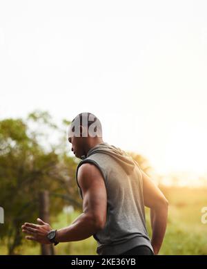 Man running in nature through the park, sports in the city Stock Photo ...