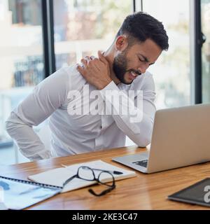 Young arab man working at pain recovery clinic showing and pointing up ...