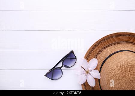 Vintage fabricate straw hat and sunglasses isolated on white background ...