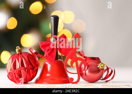 Note sign with Christmas balls and bell on white background Stock Photo ...