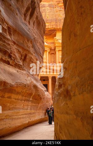 The first glimpse of the treasury building at the end of As Siq, Petra ...