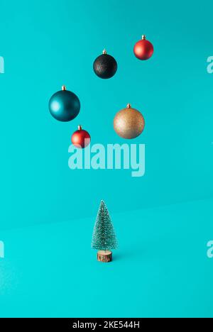 Green Christmas baubles levitating, on green background; Minimal ...