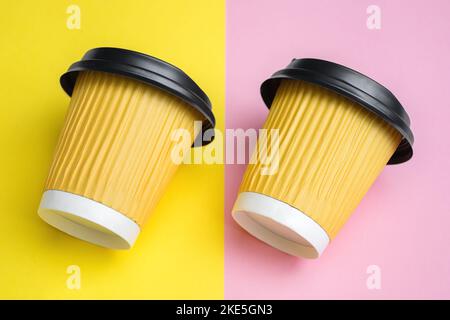 Two paper cups with lid for tea to go. Coffee take away on the table ...