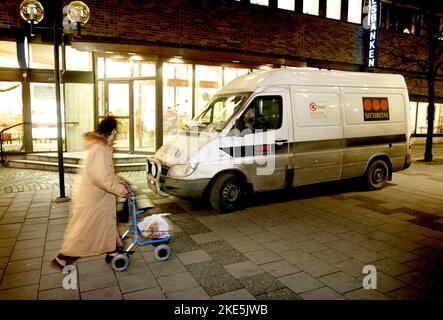Securitas cash transport vehicle outside a bank. Securitas AB is a ...