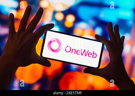 In this photo illustration, the OneWeb logo is displayed on a ...