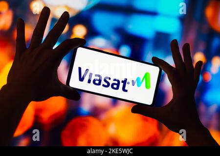 In this photo illustration, the ViaSat Inc. logo is displayed on a ...