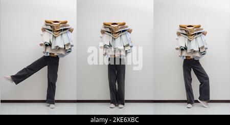 Woman holding pile of clothes. Minimal fashion faceless portrait Stock ...