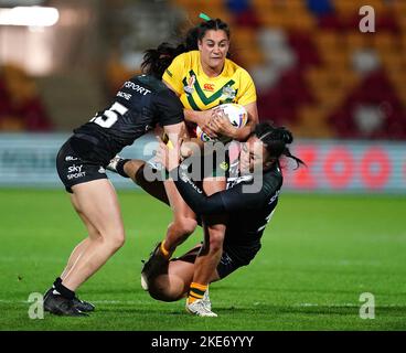 Australia's Yasmin Clydesdale is tackled by New Zealand's Brianna Clark ...