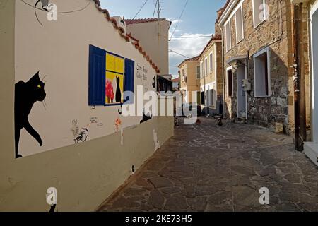 Stone House gallery, with cartoon mural of cats and mice. Petra Lesbos ...