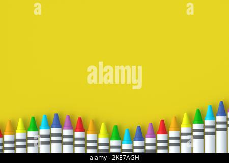 Row of wax crayons on yellow background. Colorful pencils. Back to ...