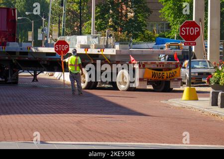 Flagger holding stop sign at construction site Stock Photo - Alamy