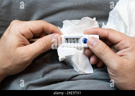 Digital thermometer indicating very high fever Stock Photo - Alamy