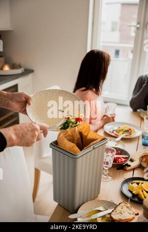 Family cleaning after having dinner Stock Photo - Alamy