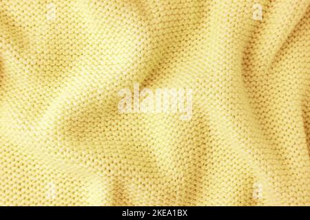 Yellow color crumpled knitting wool texture. Close up background of ...