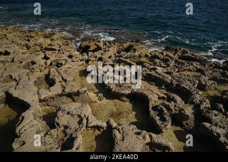 saint peter pools Malta rock formation hole on rocks view Stock Photo ...
