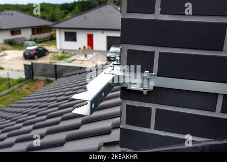 Chimney holder for mounting a satellite dish on the chimney, close-up ...