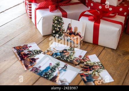 photos next to Christmas gift boxes Stock Photo - Alamy