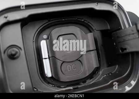 Close up of electric vehicle AC and DC charge port options on modern ...