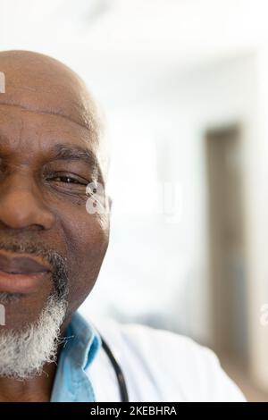 Portrait of half the face of african american male healthcare worker in ...