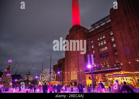Ice Skating At Battersea Power Station at Night London UK Stock Photo ...