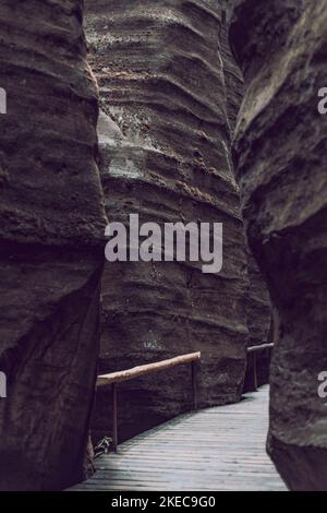 Natural tunnel between rocks. Narrow path in jungle Stock Photo - Alamy