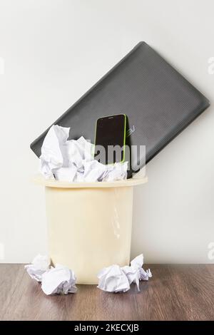 Black laptop in a trash bin on a red background isolated Stock Photo ...