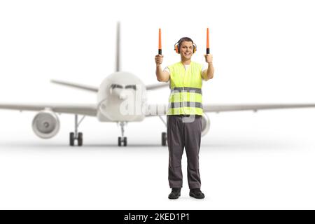 Aircraft marshaller signaling with wands at an airport apron Stock ...