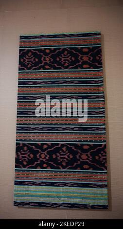 a wall board covered with batik cloth Stock Photo - Alamy