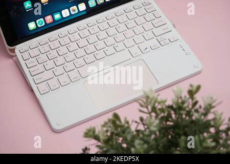 working with External portable wireless keyboard computer connected to ...