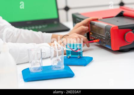 girl student make experiments with hydrogen fuel cell Stock Photo - Alamy