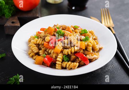 Vegetable pasta fusilli corti bucati with eggplant, sweet pepper and ...