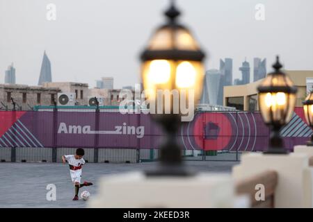 Doha, Qatar. 8th Nov, 2022. A boy plays football at the Souq Waqif in ...