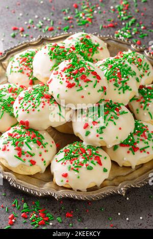 Cookies with colorful sprinkles in plate and cup of tea on blue table close up Stock Photo - Alamy