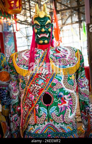 Elaborate, colourful life-size puppet of a demon, used in processions ...