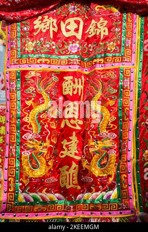 A richly embroidered processional banner featuring a dragon motif at ...