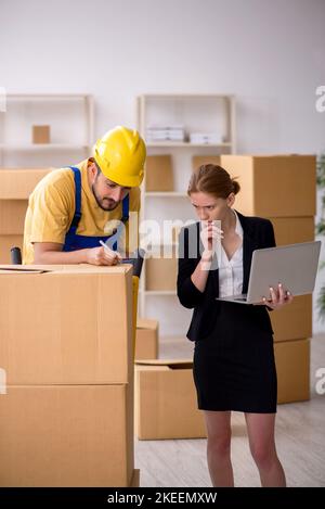 Female boss and male contractor doing home relocation Stock Photo - Alamy