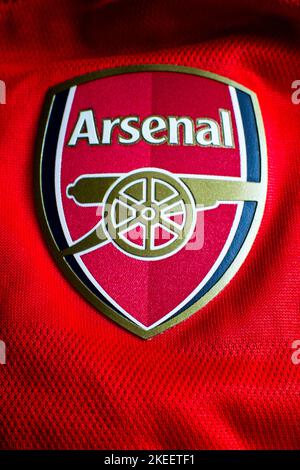 English Arsenal team logo sewn on a red jersey. Famous team of the ...