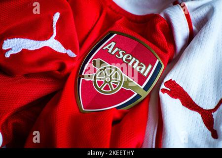 English Arsenal team logo sewn on a red jersey. Famous team of the ...